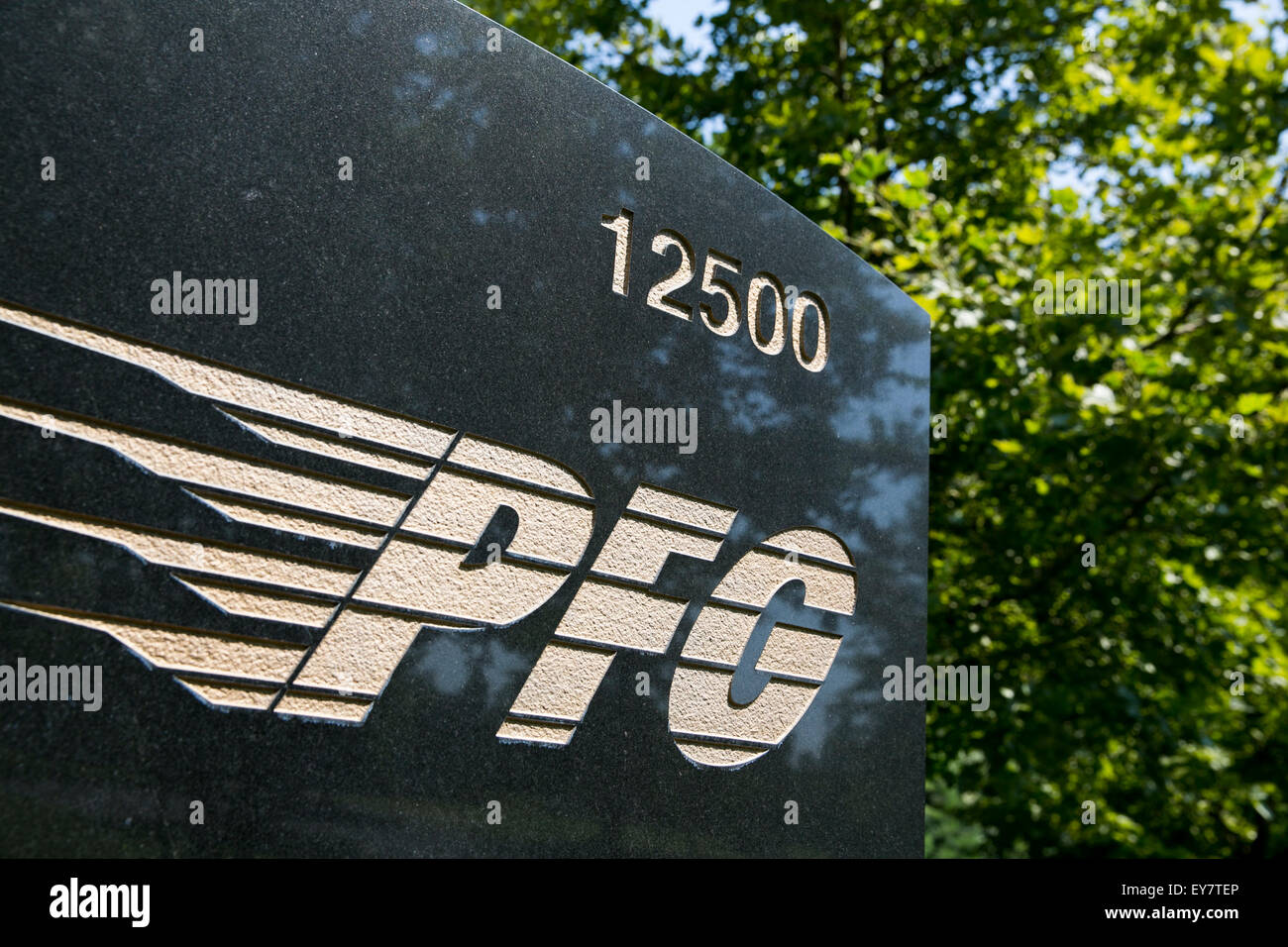 A logo sign outside of the headquarters of the Performance Food Group ...