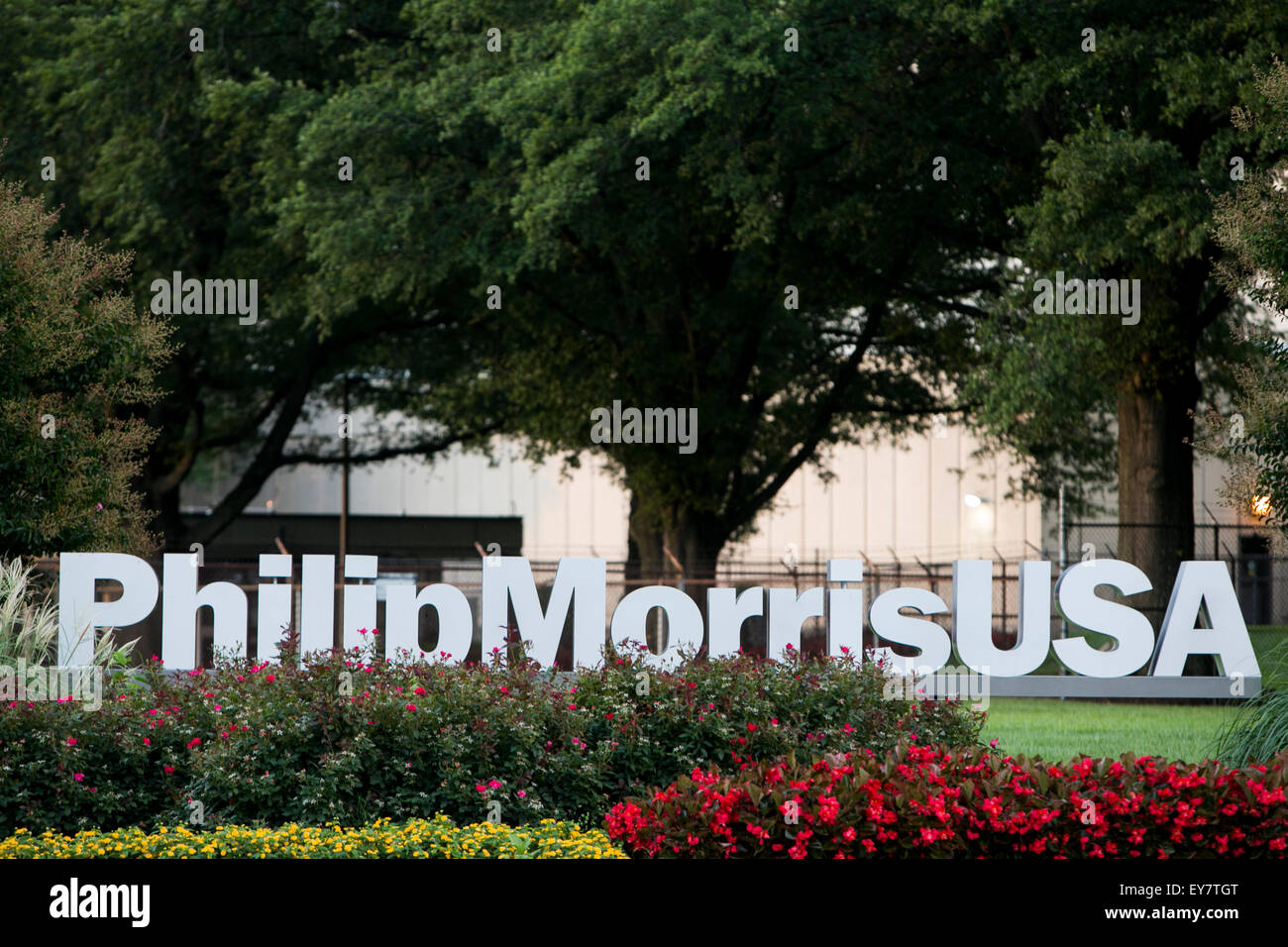 A logo sign outside of a facility occupied by Philip Morris USA, in ...