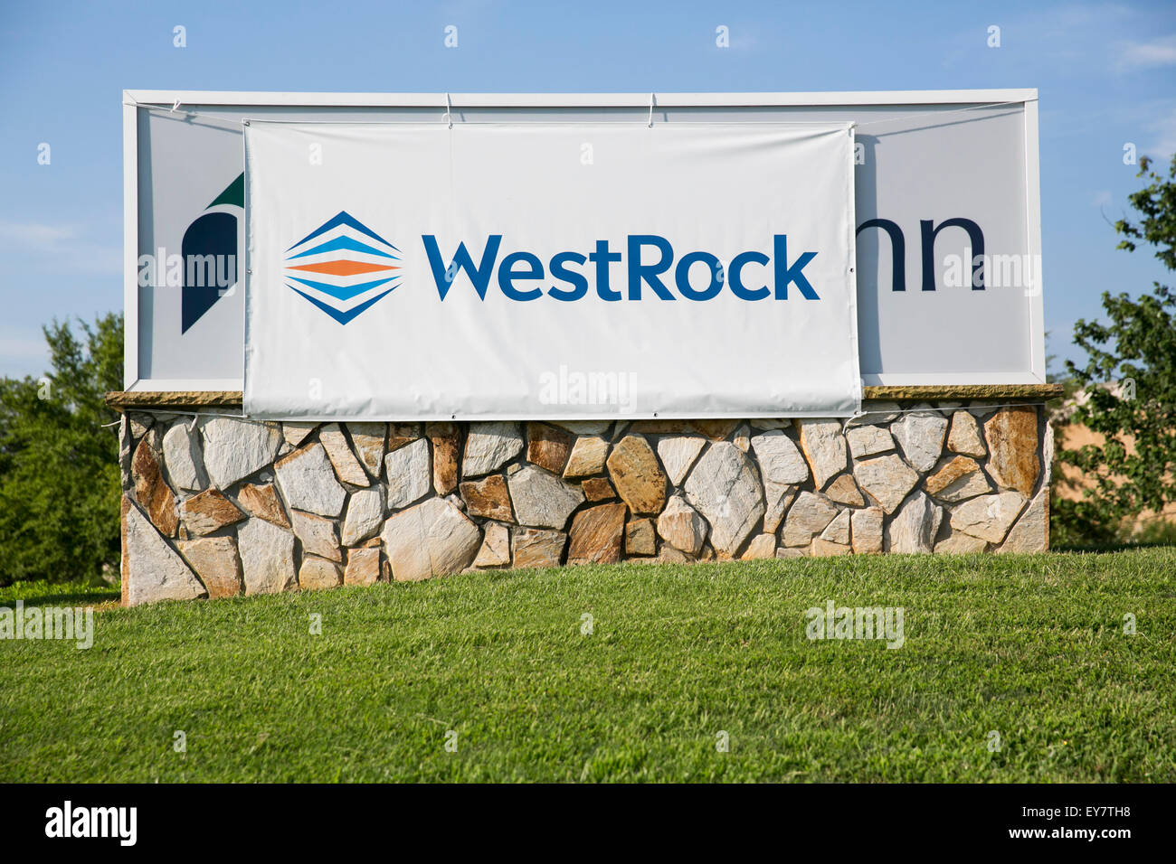A logo sign outside of a facility occupied by the WestRock Company in ...