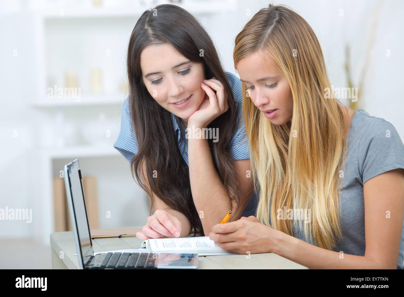 Students doing a project together Stock Photo - Alamy