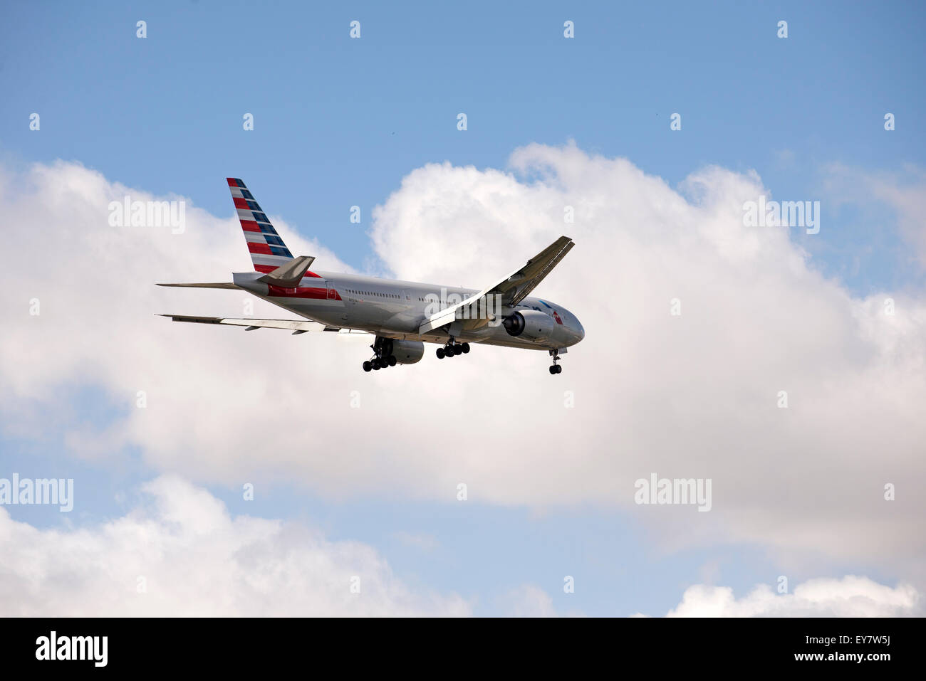 American Boeing 777 with landing gear down in preparation to land West ...