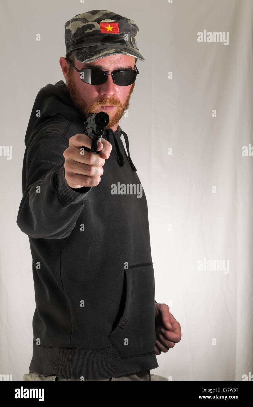 Man Holding a Pistol Gun Stock Photo - Alamy