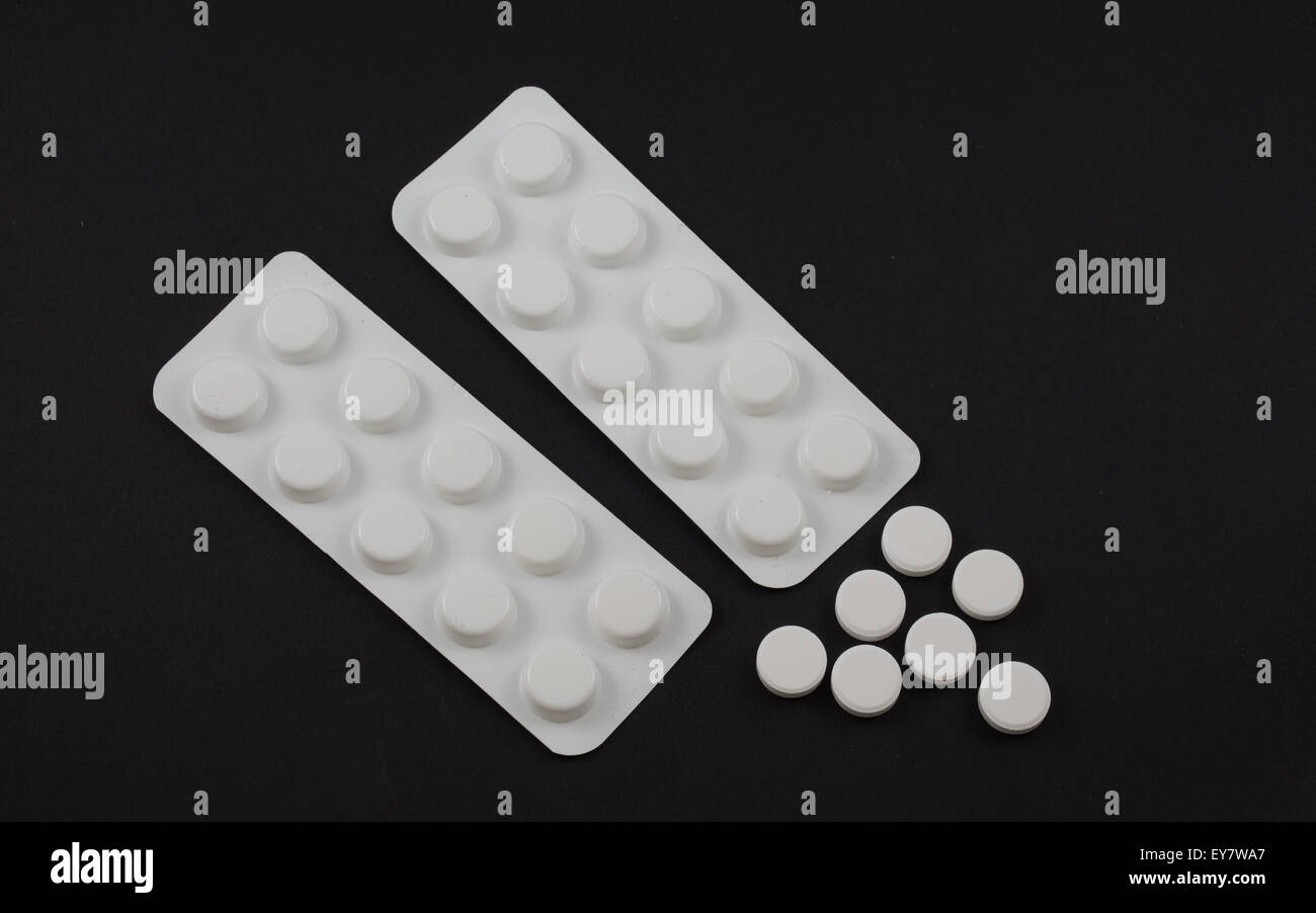 Tablet blister packs and open tablets Stock Photo - Alamy