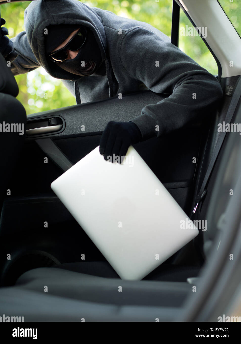 Car theft - a laptop being stolen through the window of an unoccupied ...