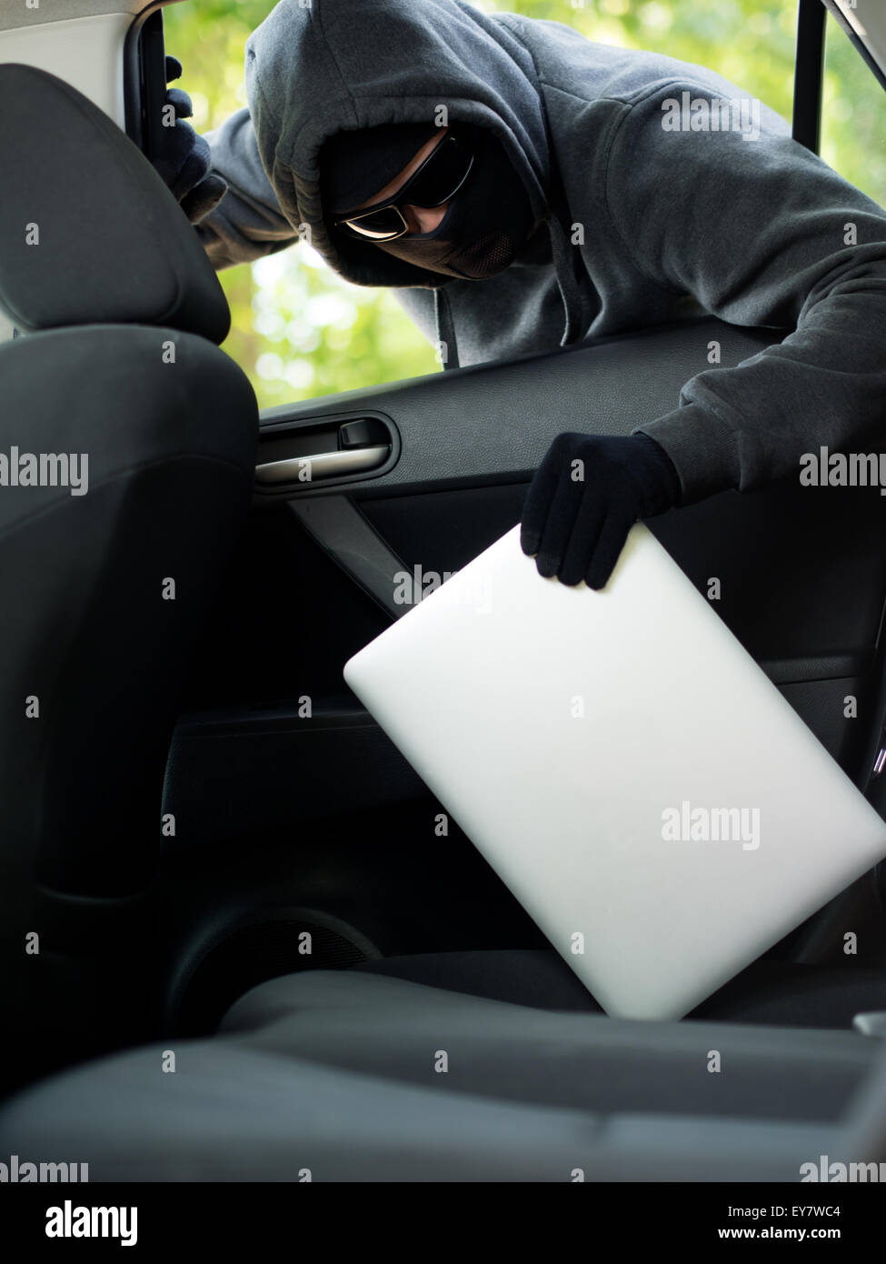 Car theft - a laptop being stolen through the window of an unoccupied ...