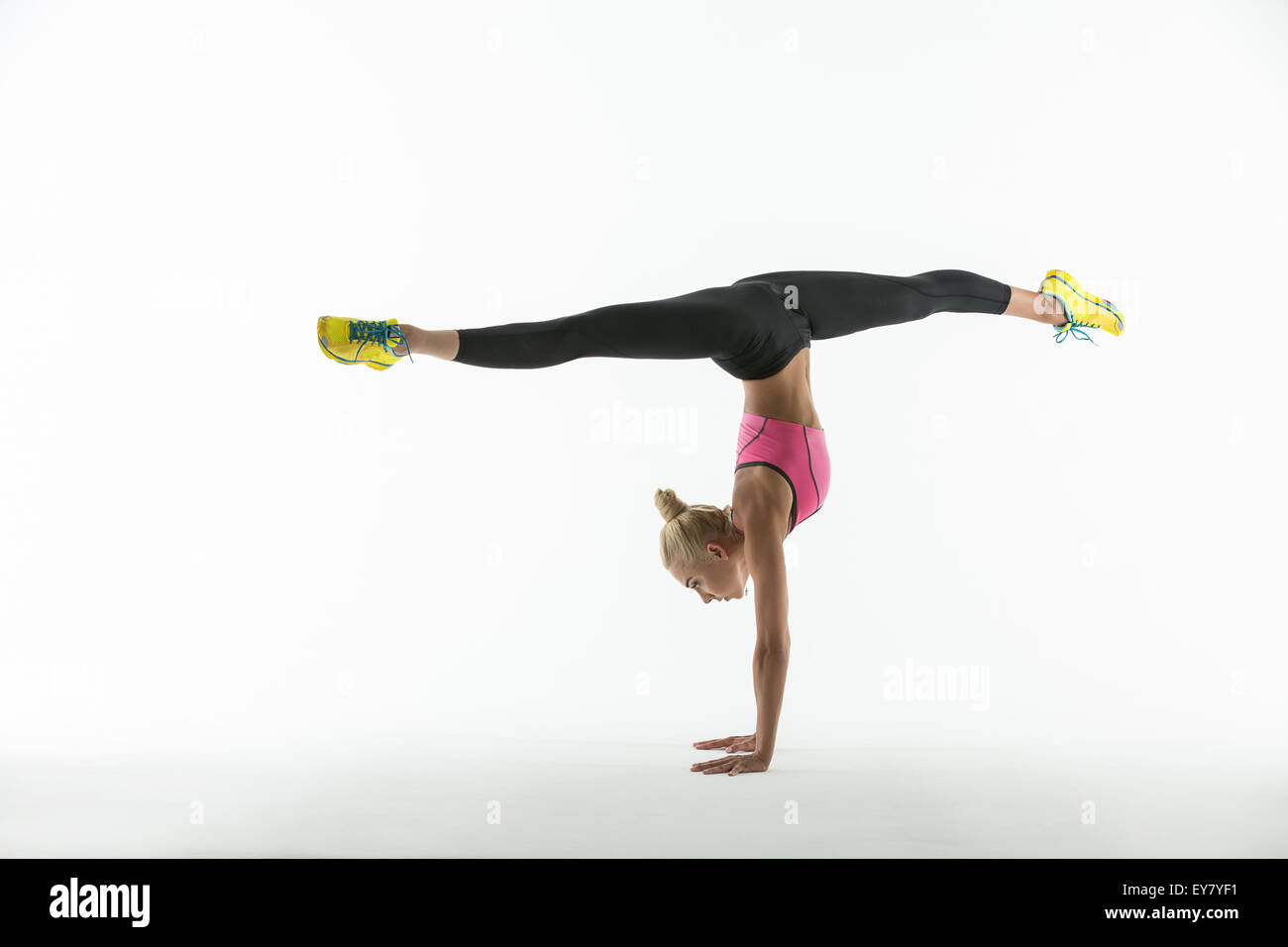 Rhythmic gymnast doing exercise in studio Stock Photo - Alamy
