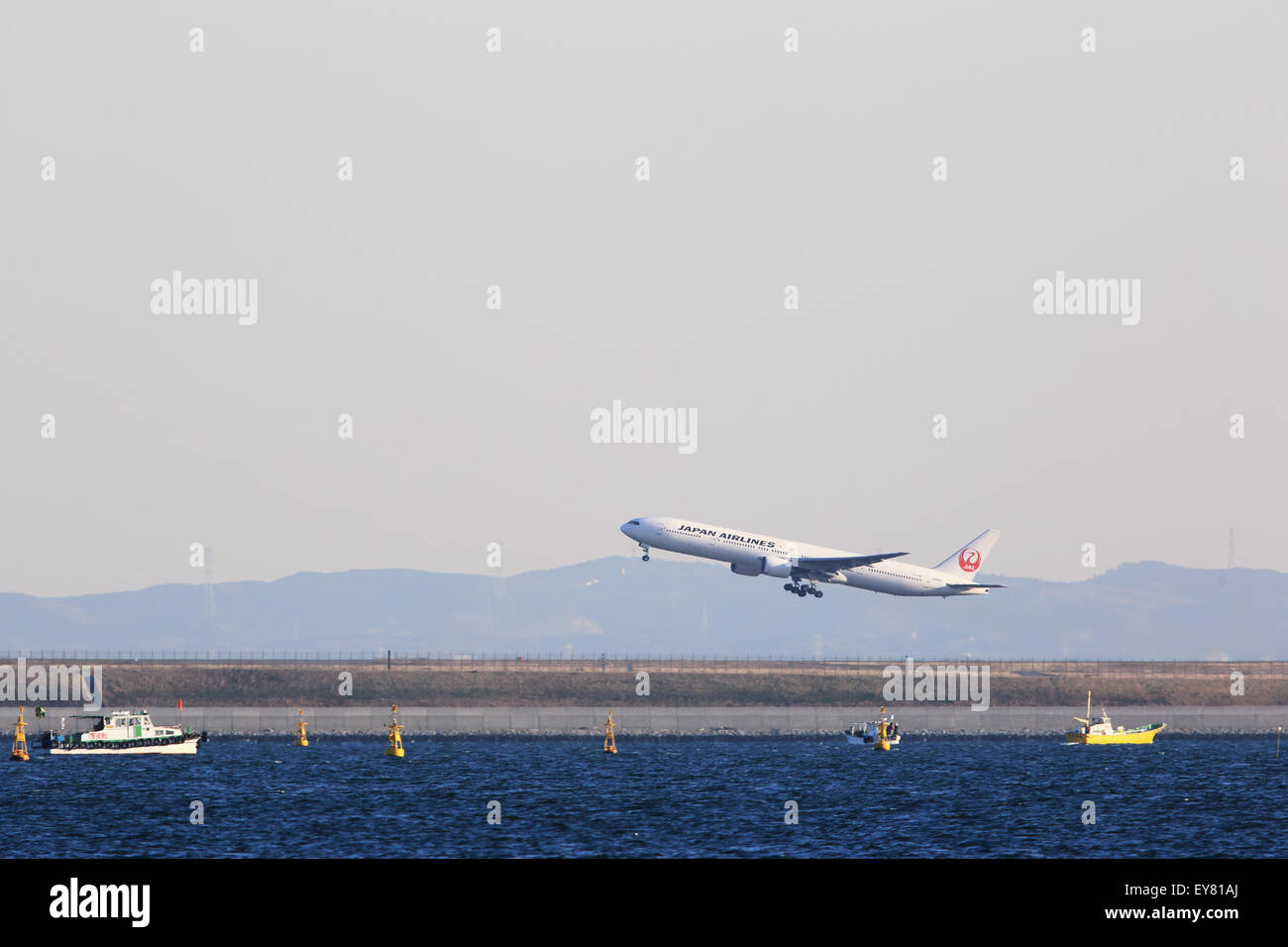Airplane flying over Haneda Airport, Tokyo, Japan Stock Photo - Alamy
