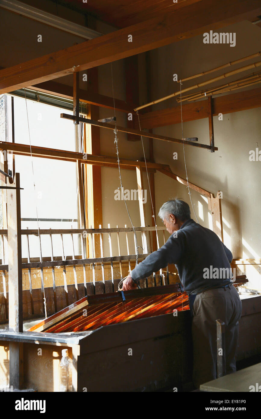 Japanese traditional paper craftsman working in his studio Stock Photo ...