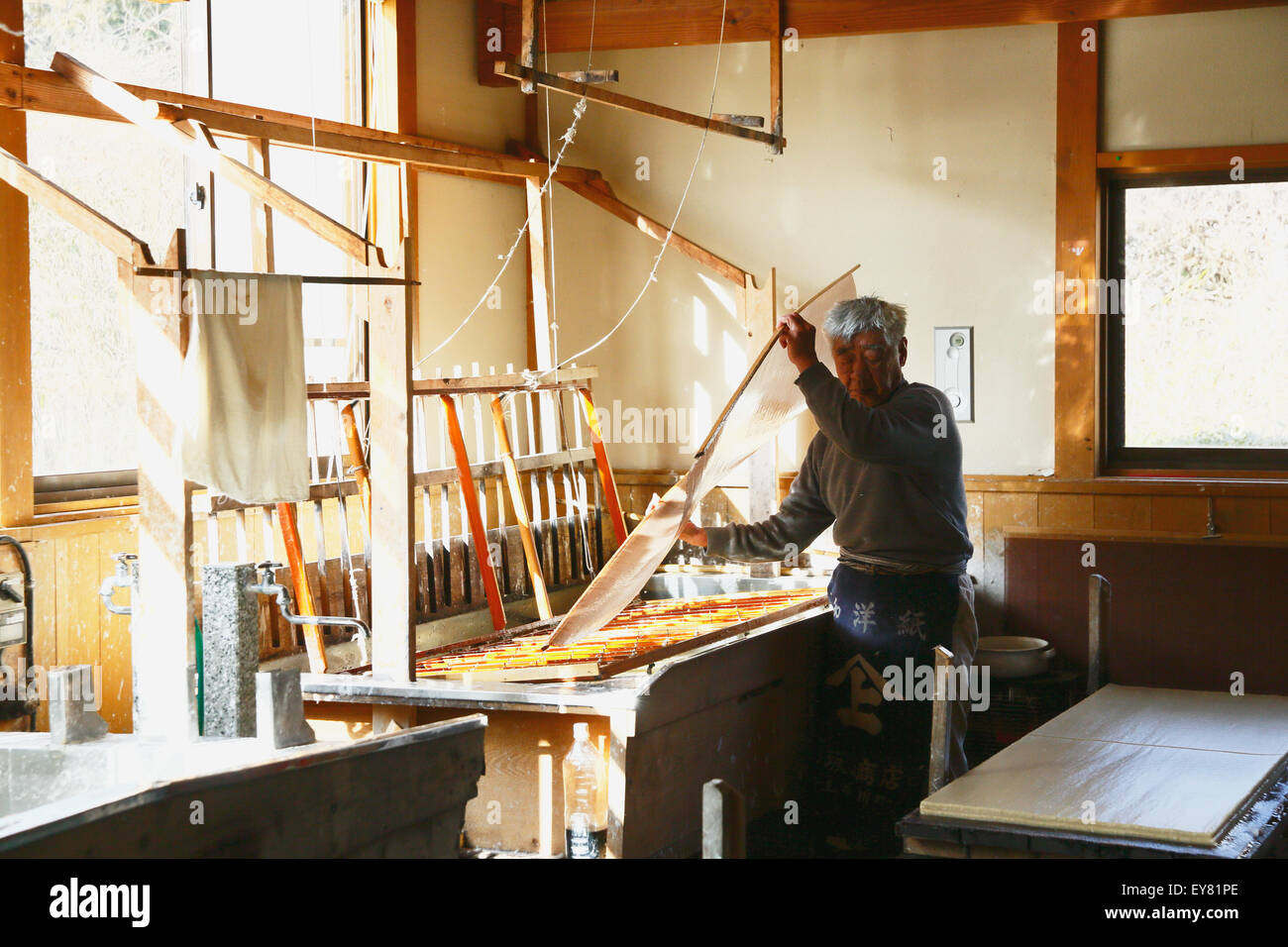 Japanese traditional paper craftsman working in his studio Stock Photo ...