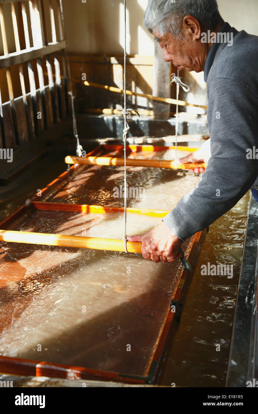 Japanese traditional paper craftsman working in his studio Stock Photo ...