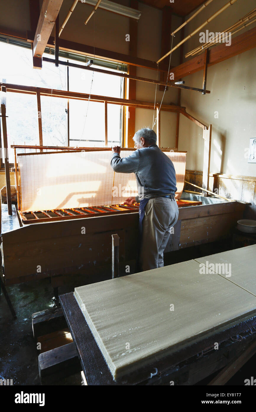 Japanese traditional paper craftsman working in his studio Stock Photo ...