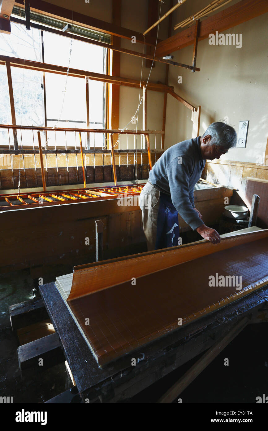 Japanese traditional paper craftsman working in his studio Stock Photo ...