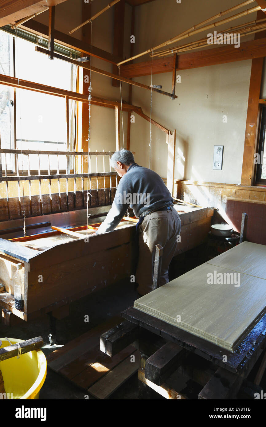 Japanese traditional paper craftsman working in his studio Stock Photo ...