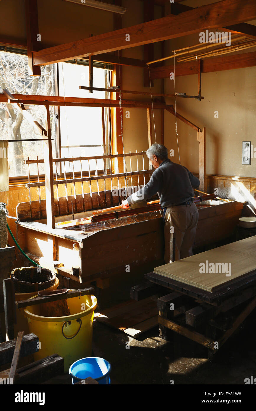 Japanese traditional paper craftsman working in his studio Stock Photo ...