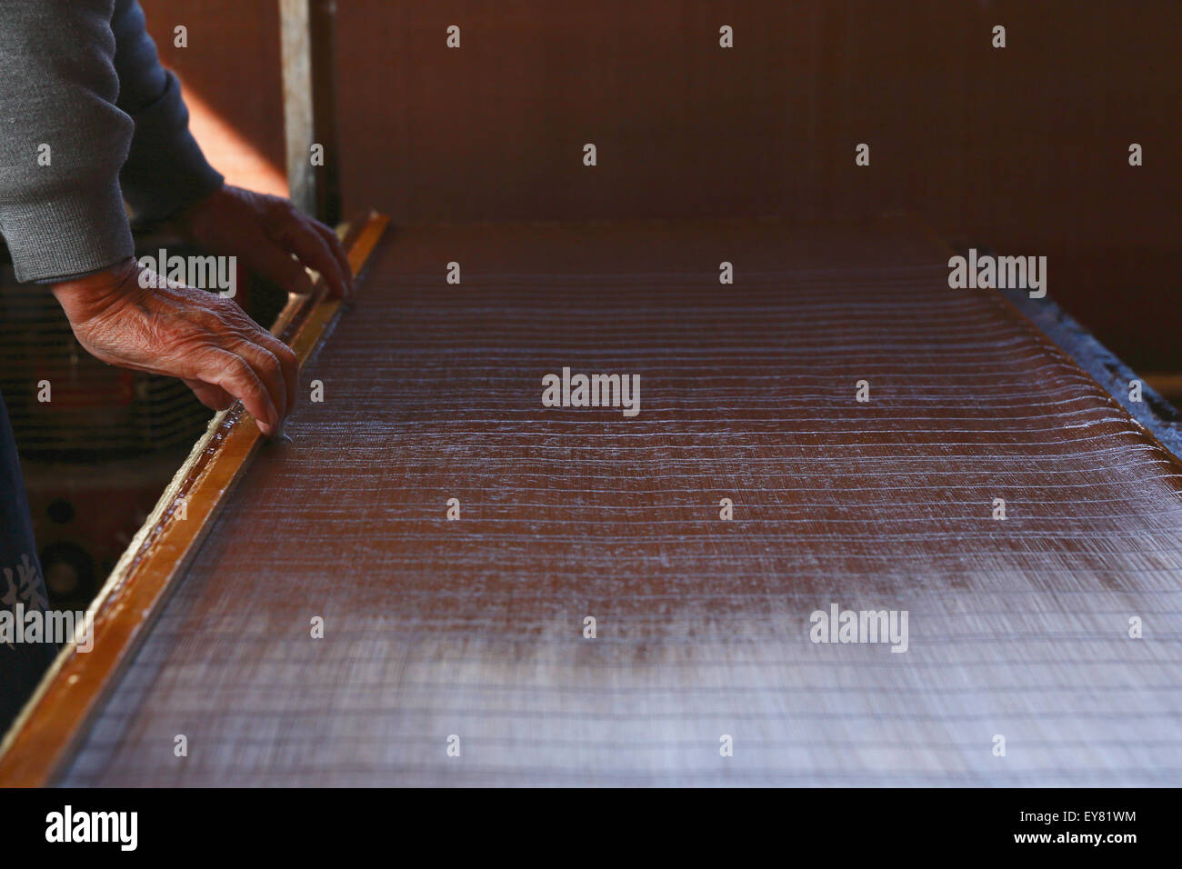 Japanese traditional paper craftsman working in his studio Stock Photo ...