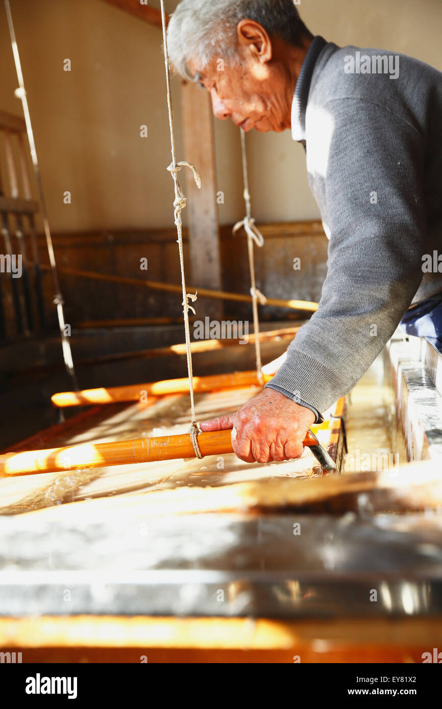 Japanese traditional paper craftsman working in his studio Stock Photo ...
