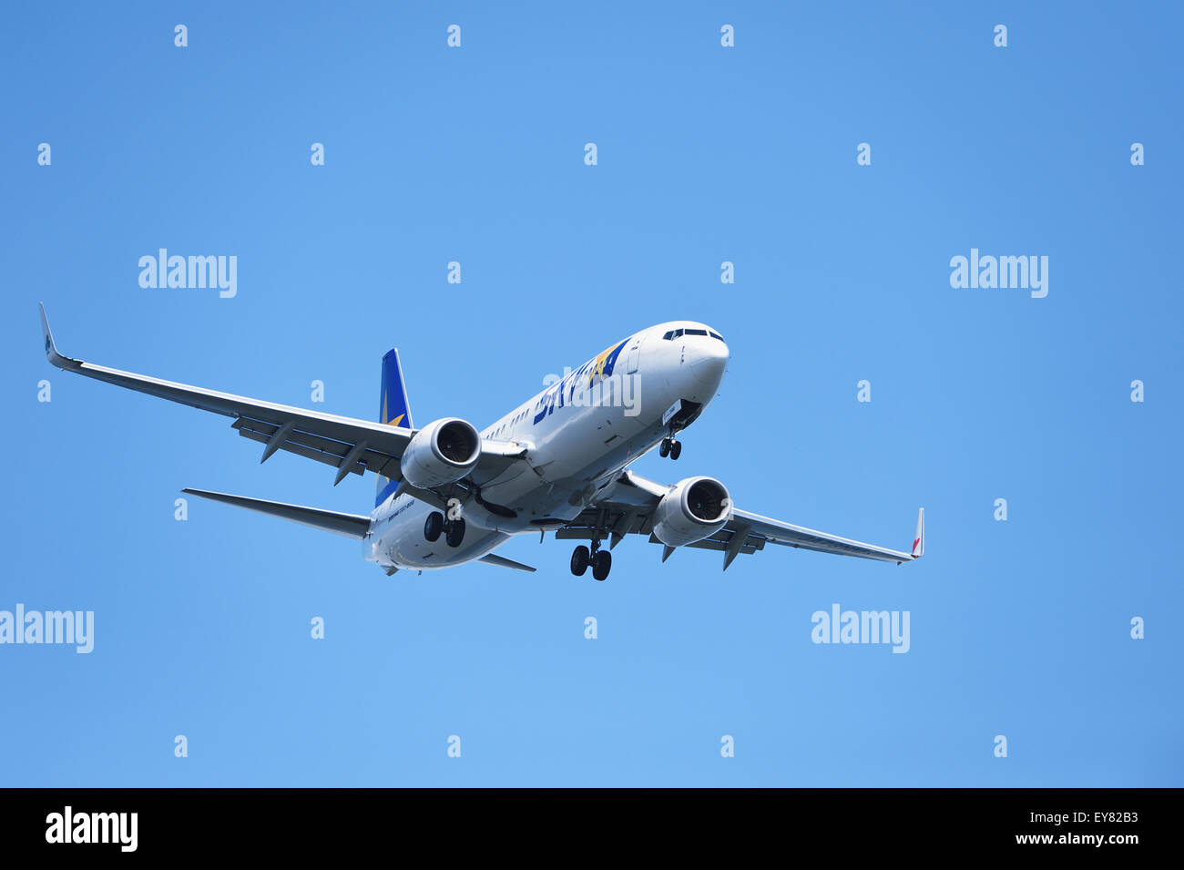 Airplane flying in the sky Stock Photo - Alamy