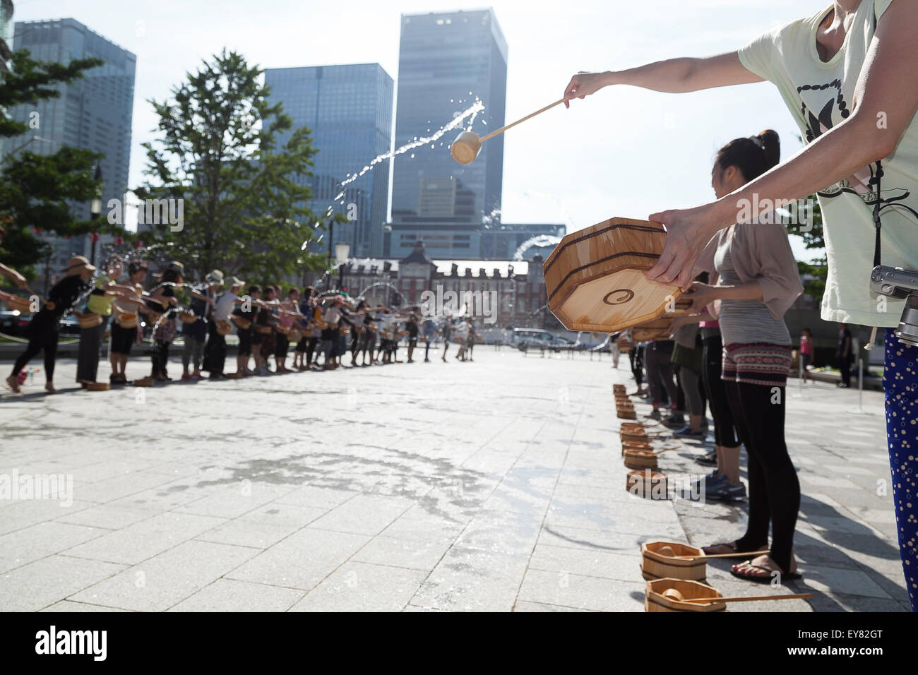 Office workers sprinkle water pavement hi-res stock photography and ...