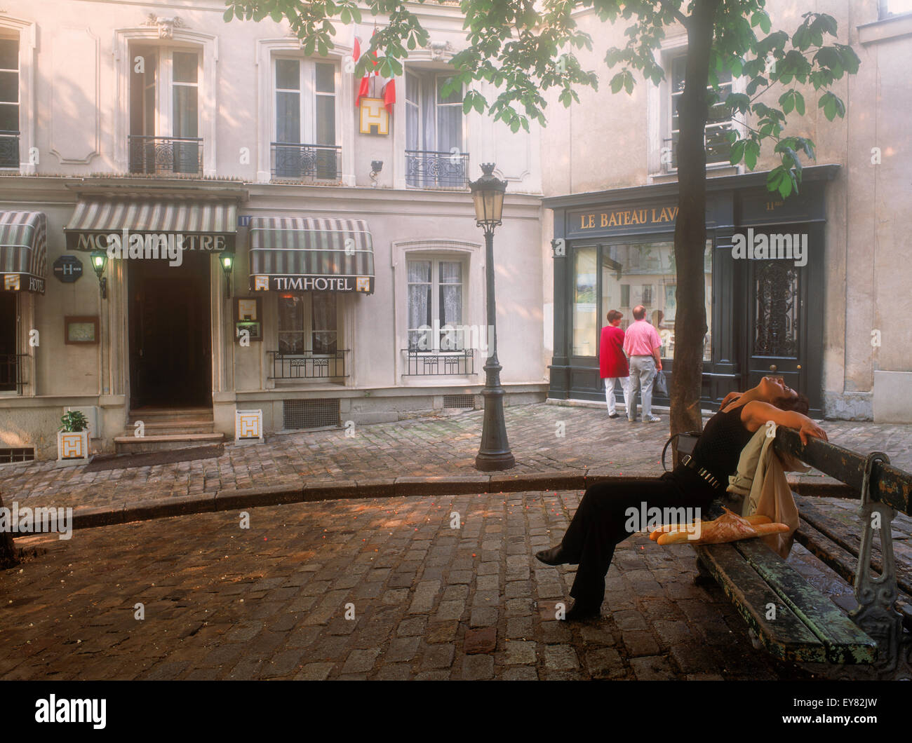 Female baguette paris sitting bench hi-res stock photography and images ...