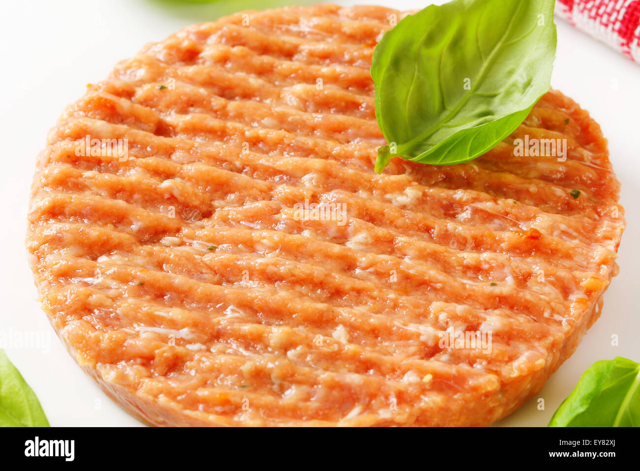 Raw burger patty - studio shot Stock Photo - Alamy