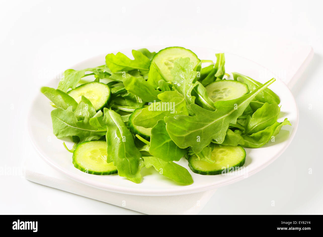 Fresh rocket salad with sliced cucumber Stock Photo - Alamy