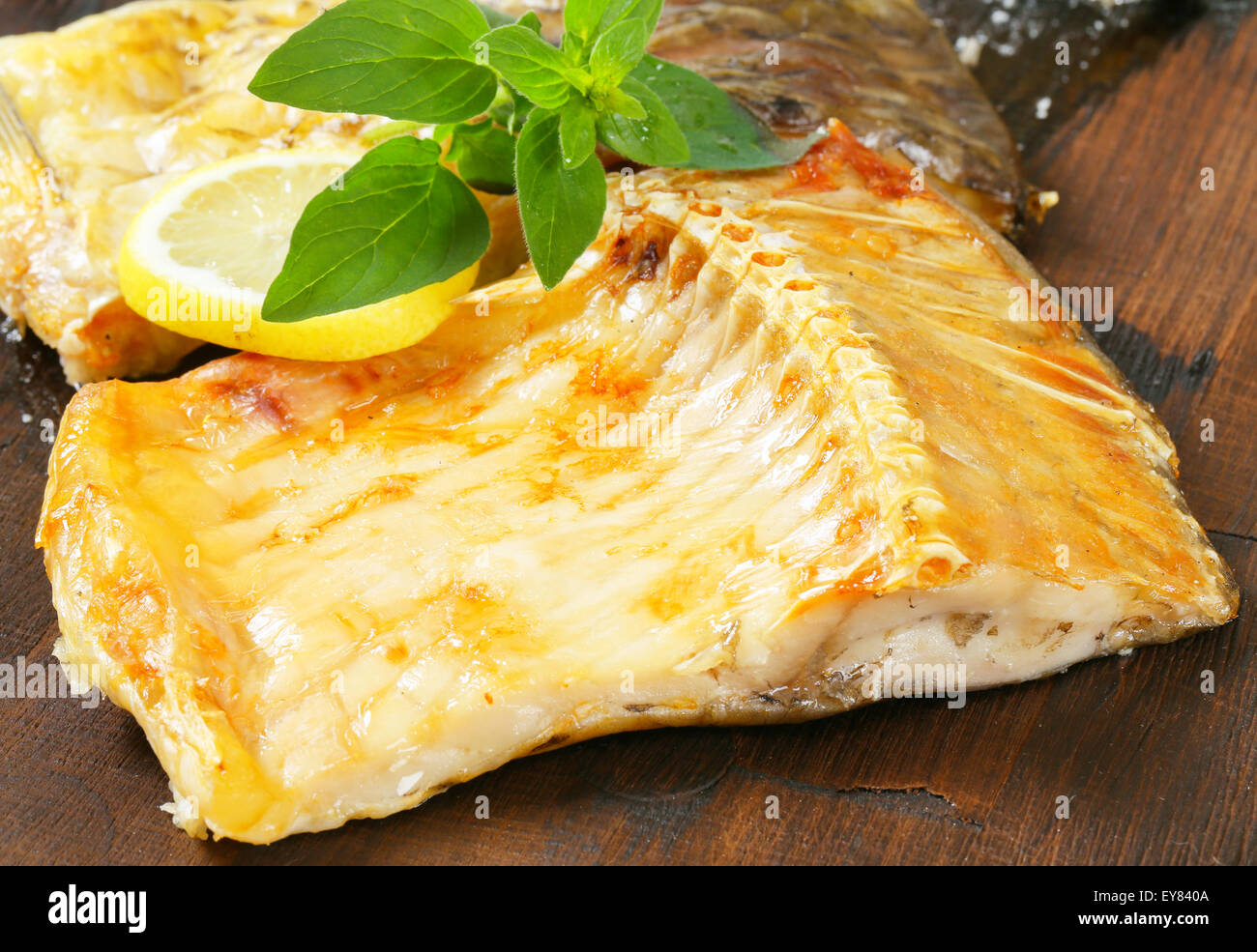 Oven baked carp fillet with lemon and dill Stock Photo - Alamy