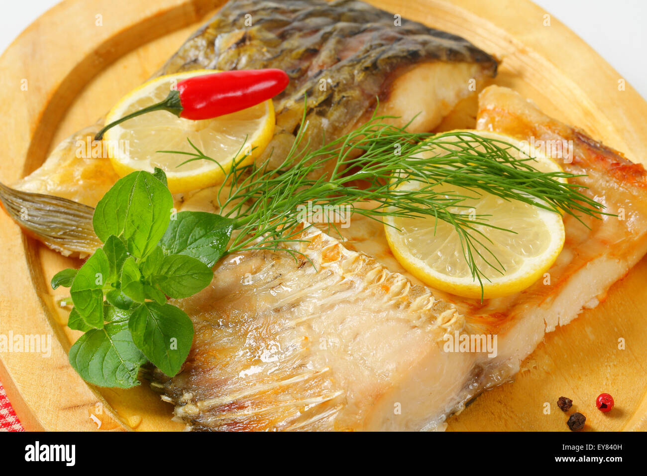 Oven baked carp fillet with lemon and dill Stock Photo - Alamy