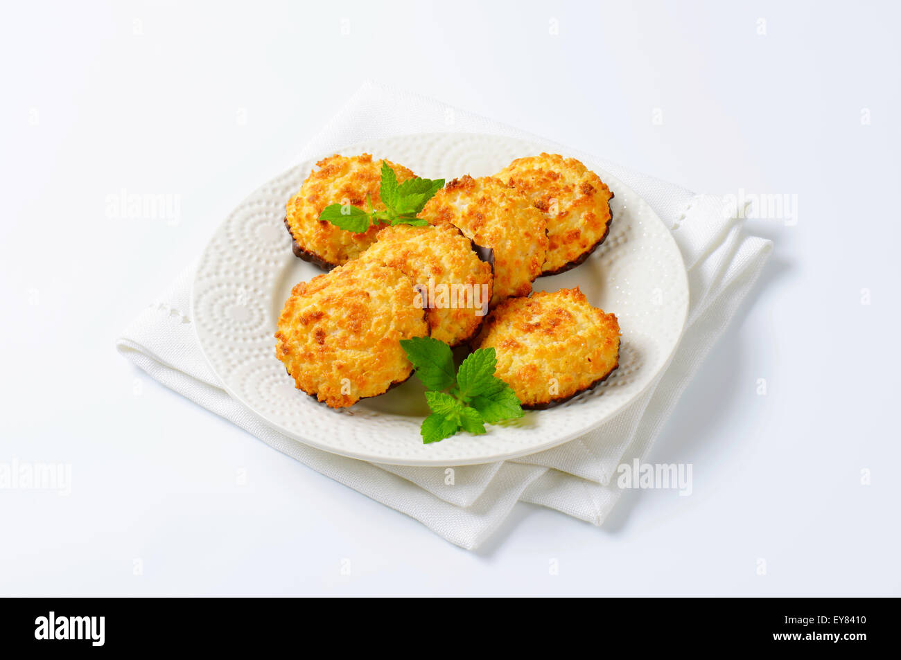 Coconut cookies dipped in bittersweet chocolate Stock Photo - Alamy
