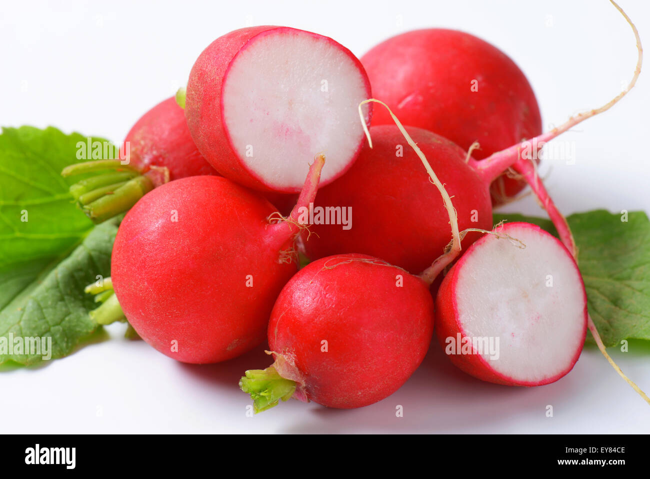 Fresh red radishes on white background Stock Photo - Alamy