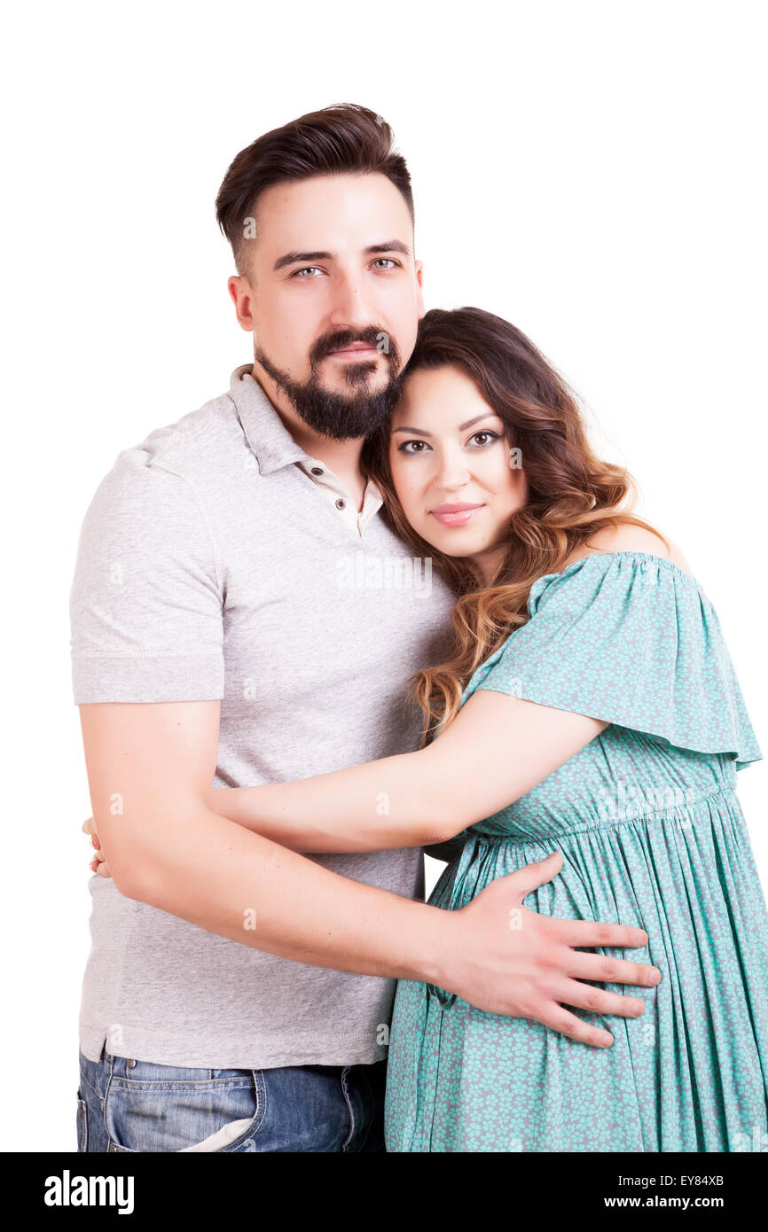 Pregnant woman with her husband isolated on white background. Studio ...