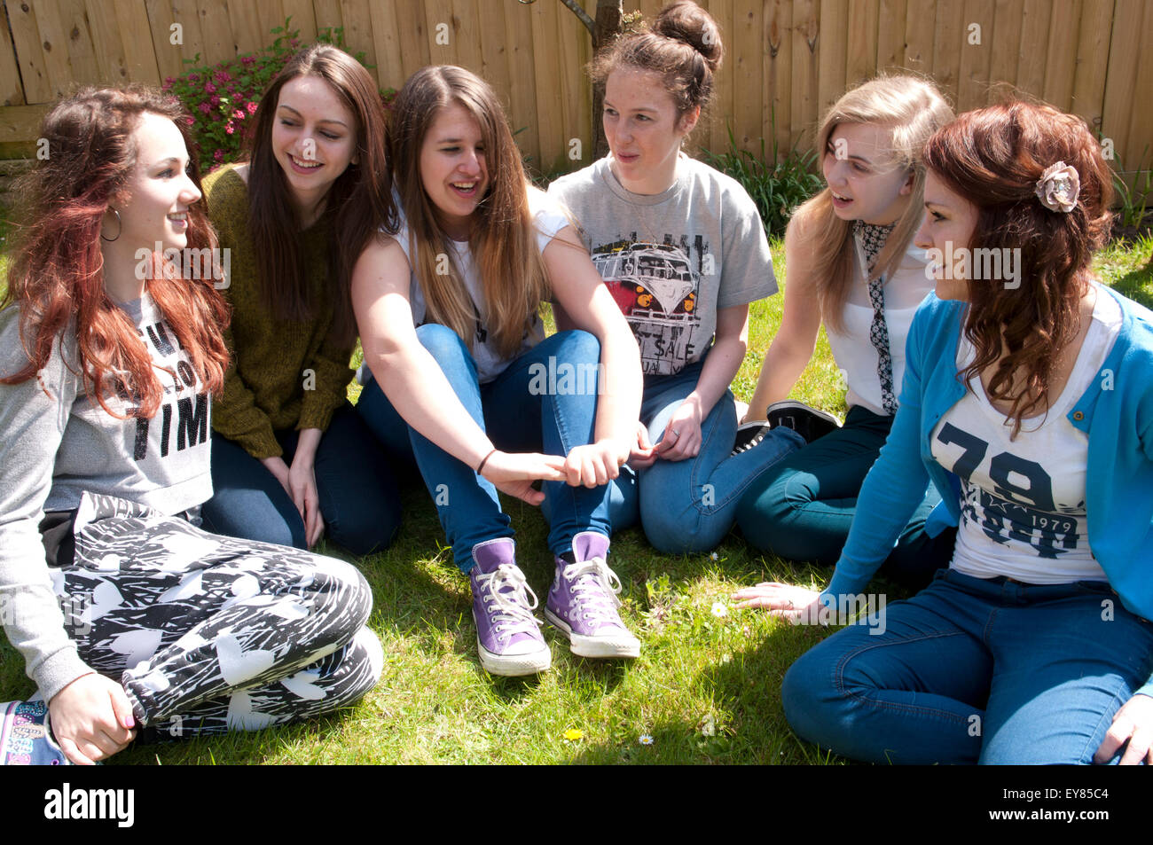 Happy group of teenage girls talking Stock Photo - Alamy