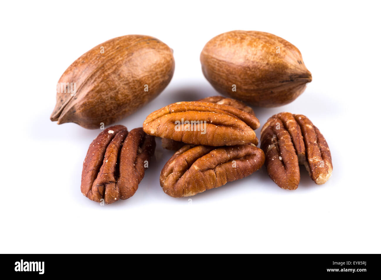Few pecan nuts isolated on white background Stock Photo - Alamy