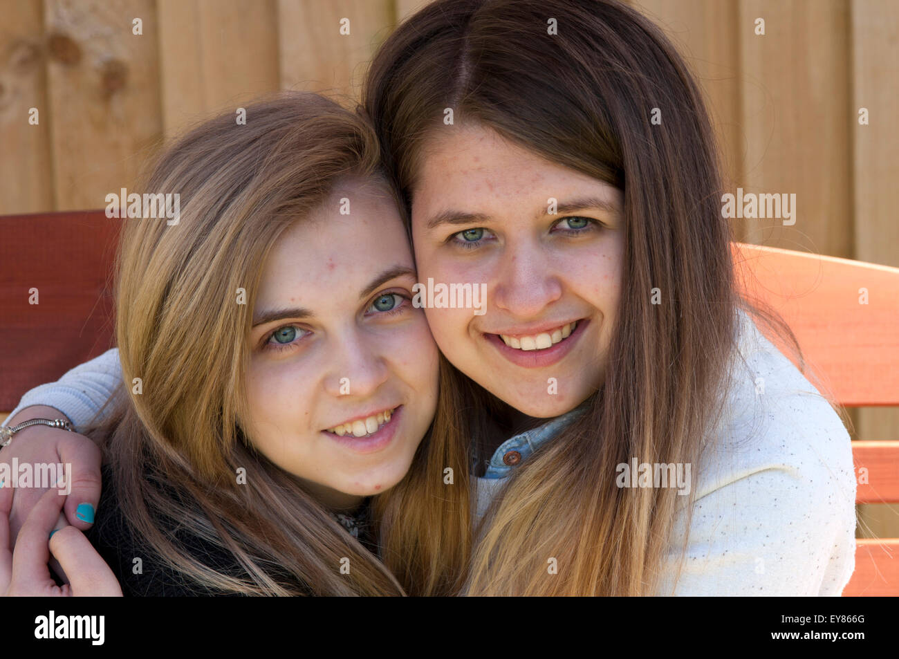 Two girls cuddling hi-res stock photography and images - Alamy