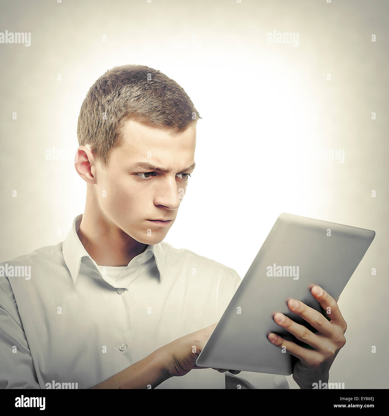 Young man using tablet pc Stock Photo - Alamy Young man using tablet pc Stock Photo - Alamy