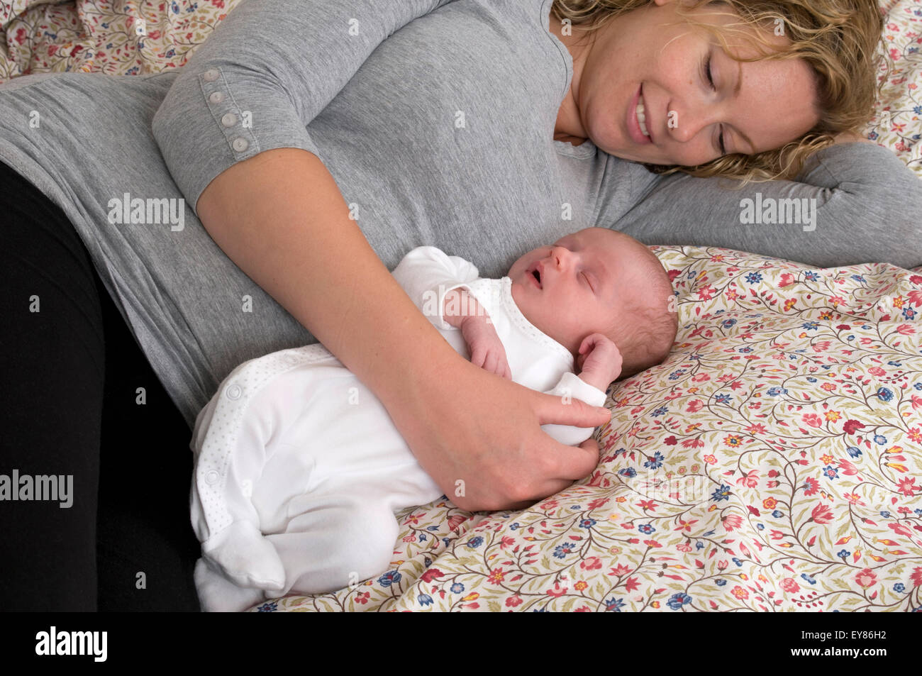 Affectionate Mom Cuddling Newborn High Resolution Stock Photography and ...