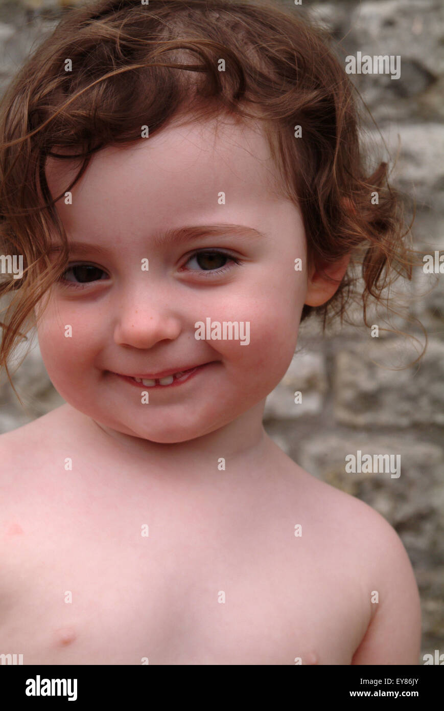Portrait of toddler with a cheeky expression Stock Photo - Alamy