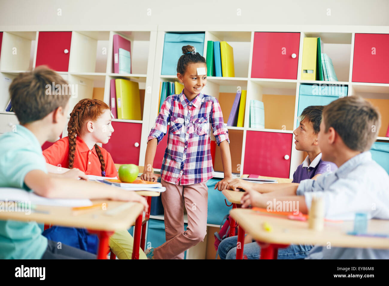 School friends guessing who they are during play Stock Photo - Alamy