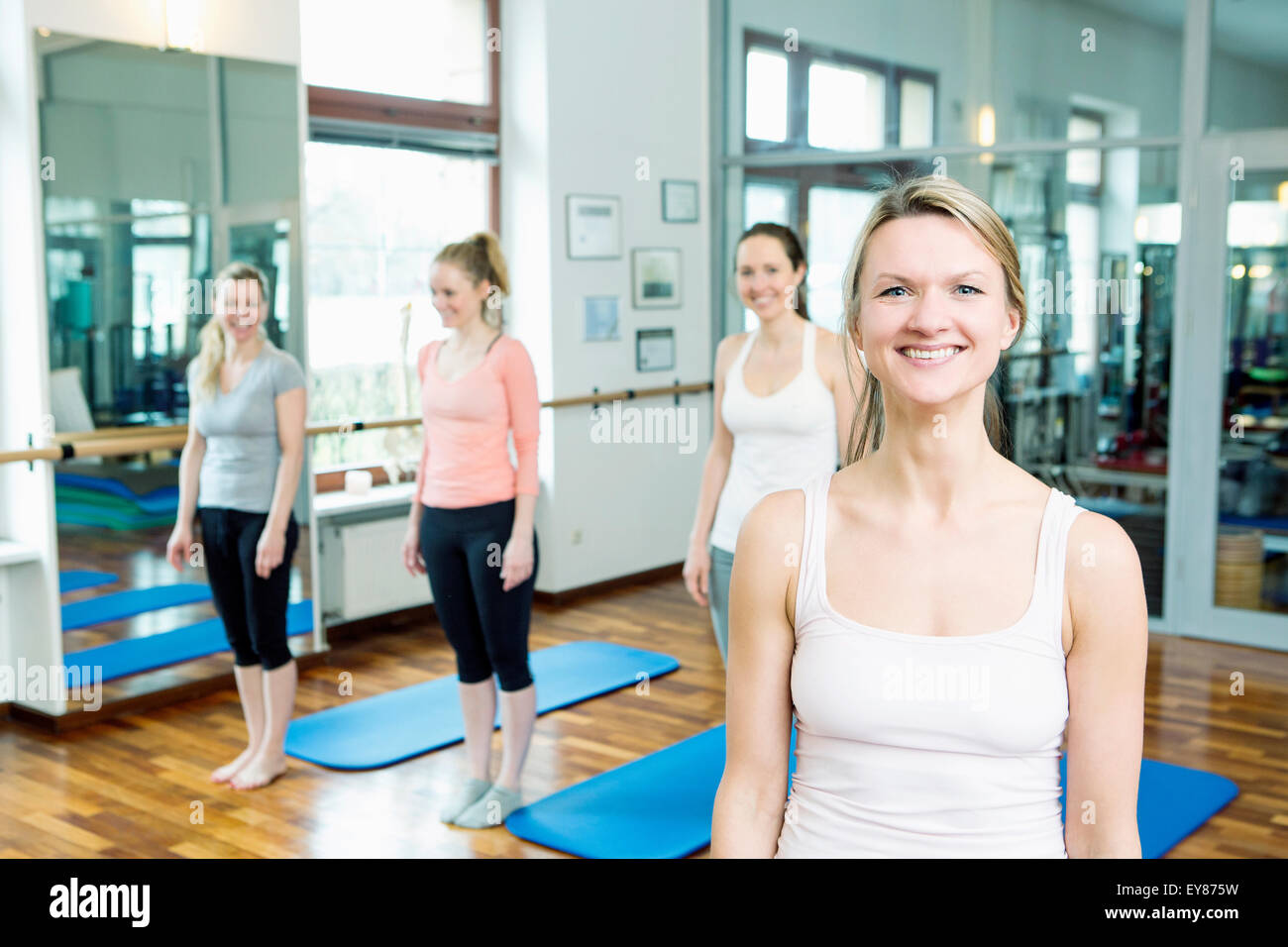Female instructor with Pilates class Stock Photo - Alamy