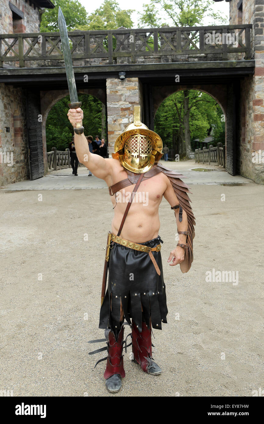 A man dressed as a Roman era gladiator by the gate of the reconstructed ...