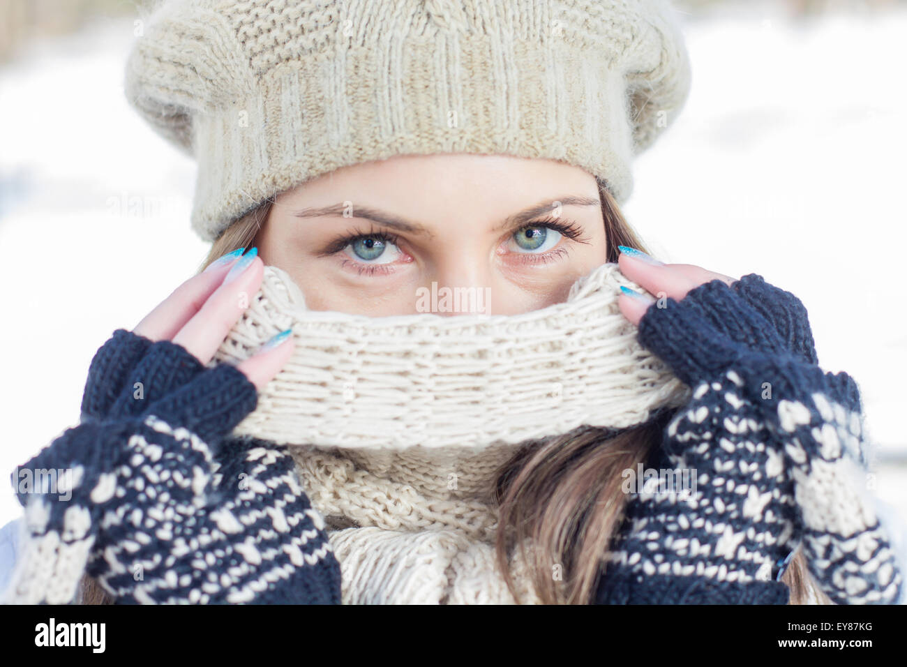 Winter Portrait of Female with Beautiful Blue Eyes outdoor. Closeup of ...