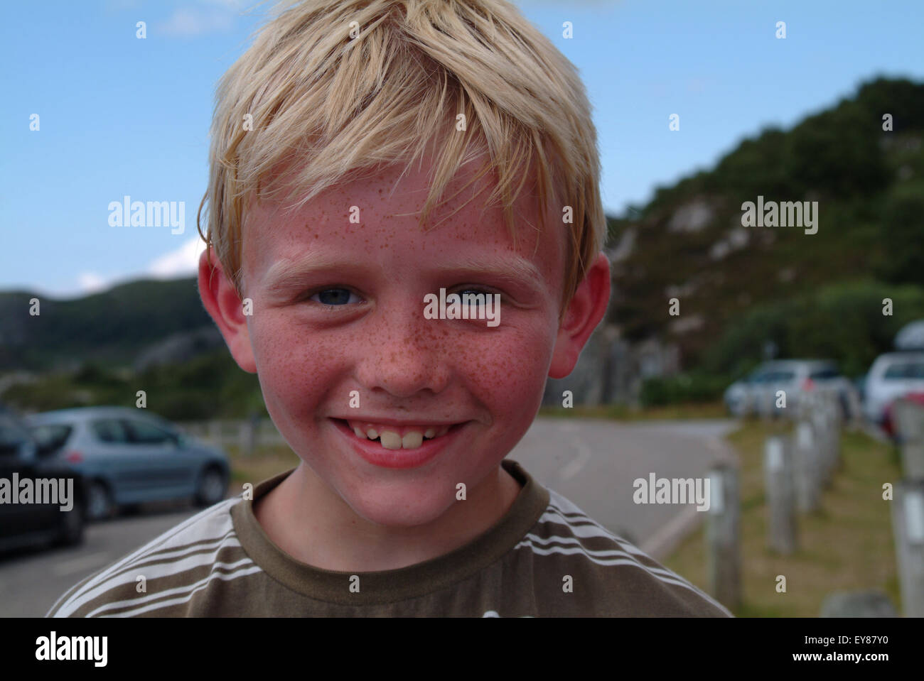Portrait of cheeky young boy smiling Stock Photo - Alamy