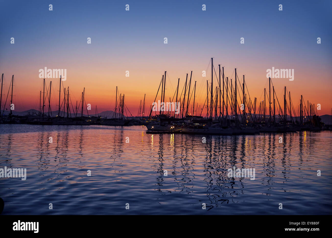 Harbor on sunset, silhouettes of luxury sailboat moored in the port in ...