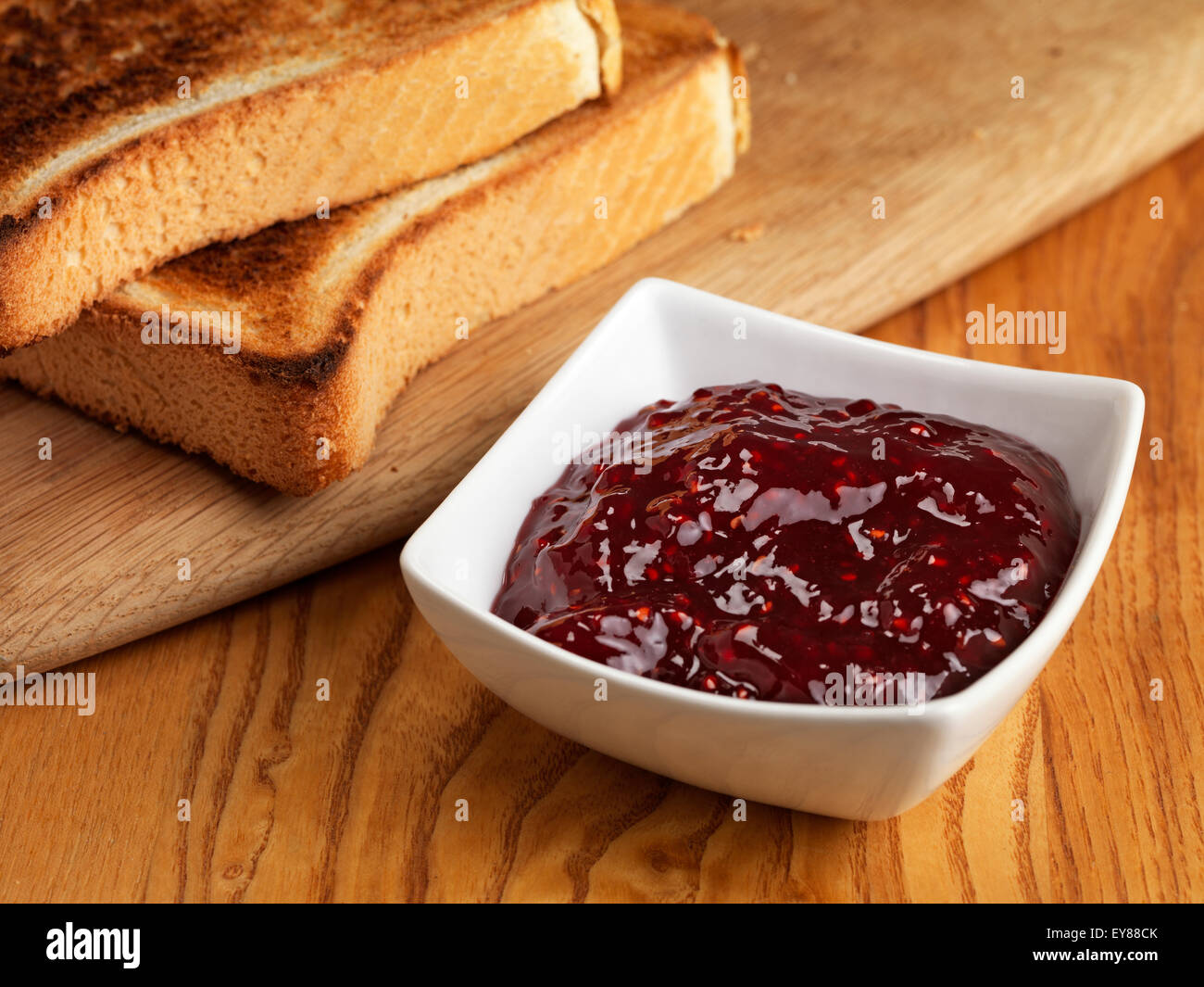 Jam with toast in background Stock Photo - Alamy