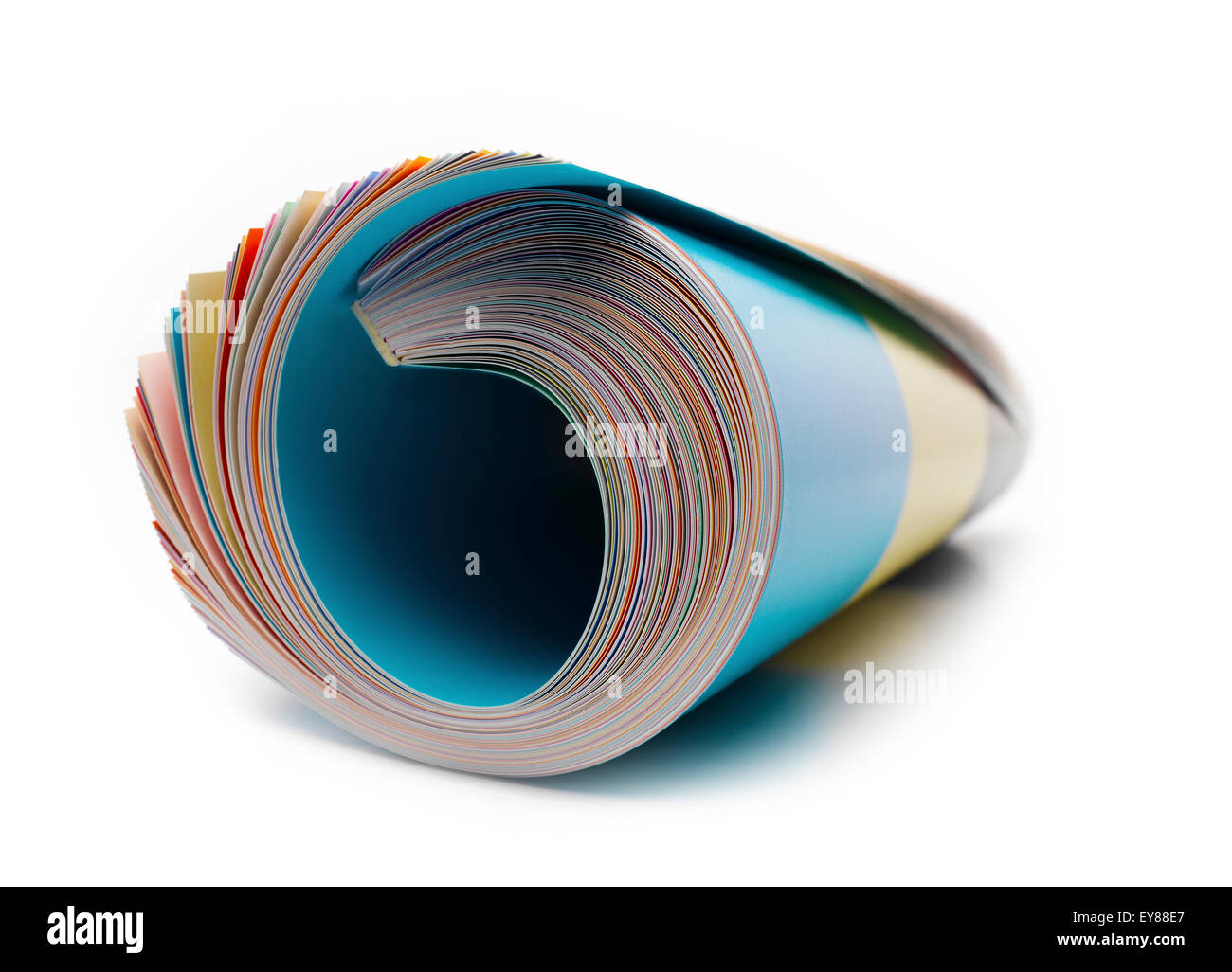 Rolled up magazine on white Stock Photo - Alamy