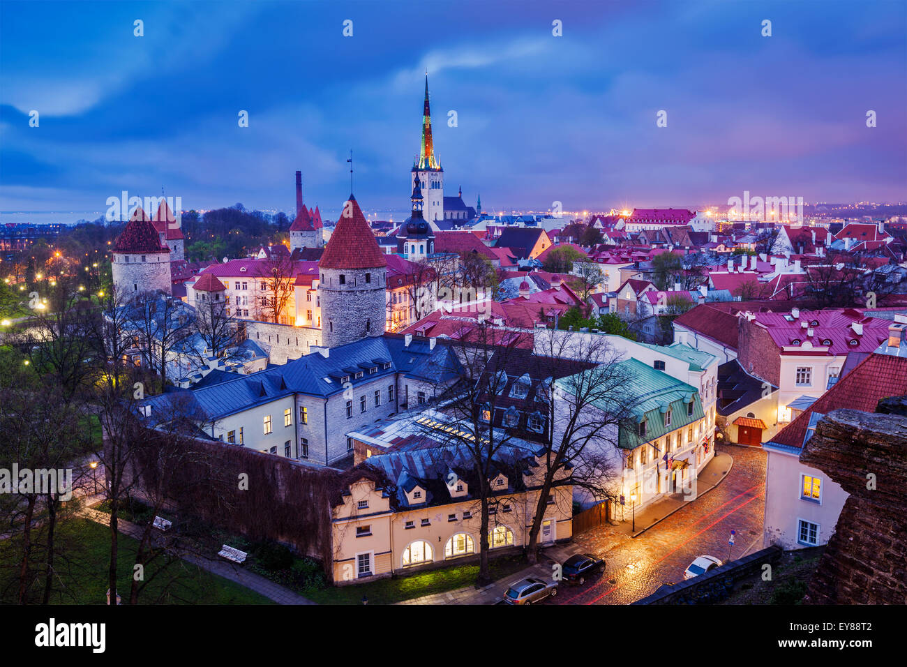 Aerial view of Tallinn Medieval Old Town illuminated in evening with ...