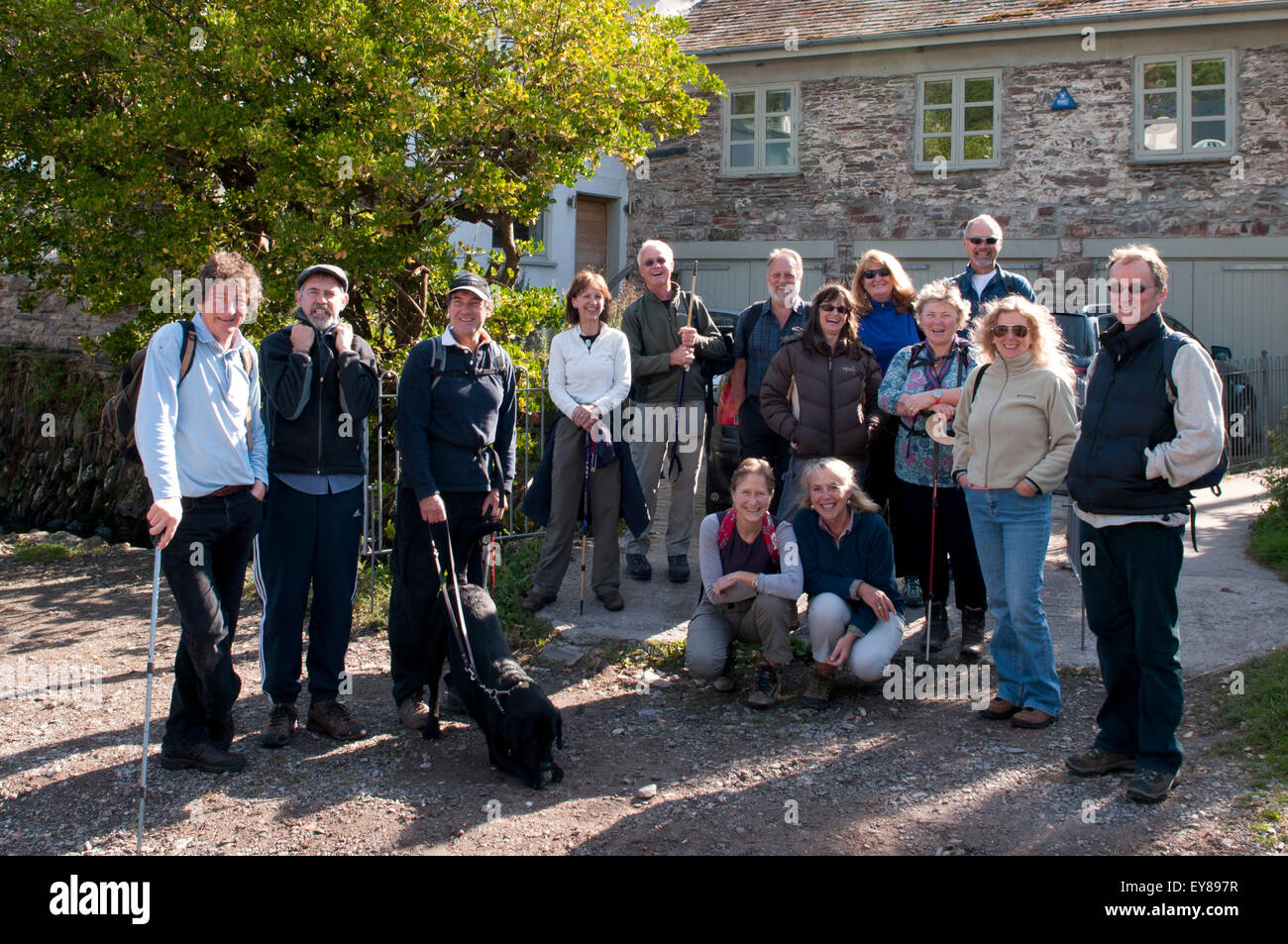 Group of mature adults posing for a photo in front of a house Stock ...