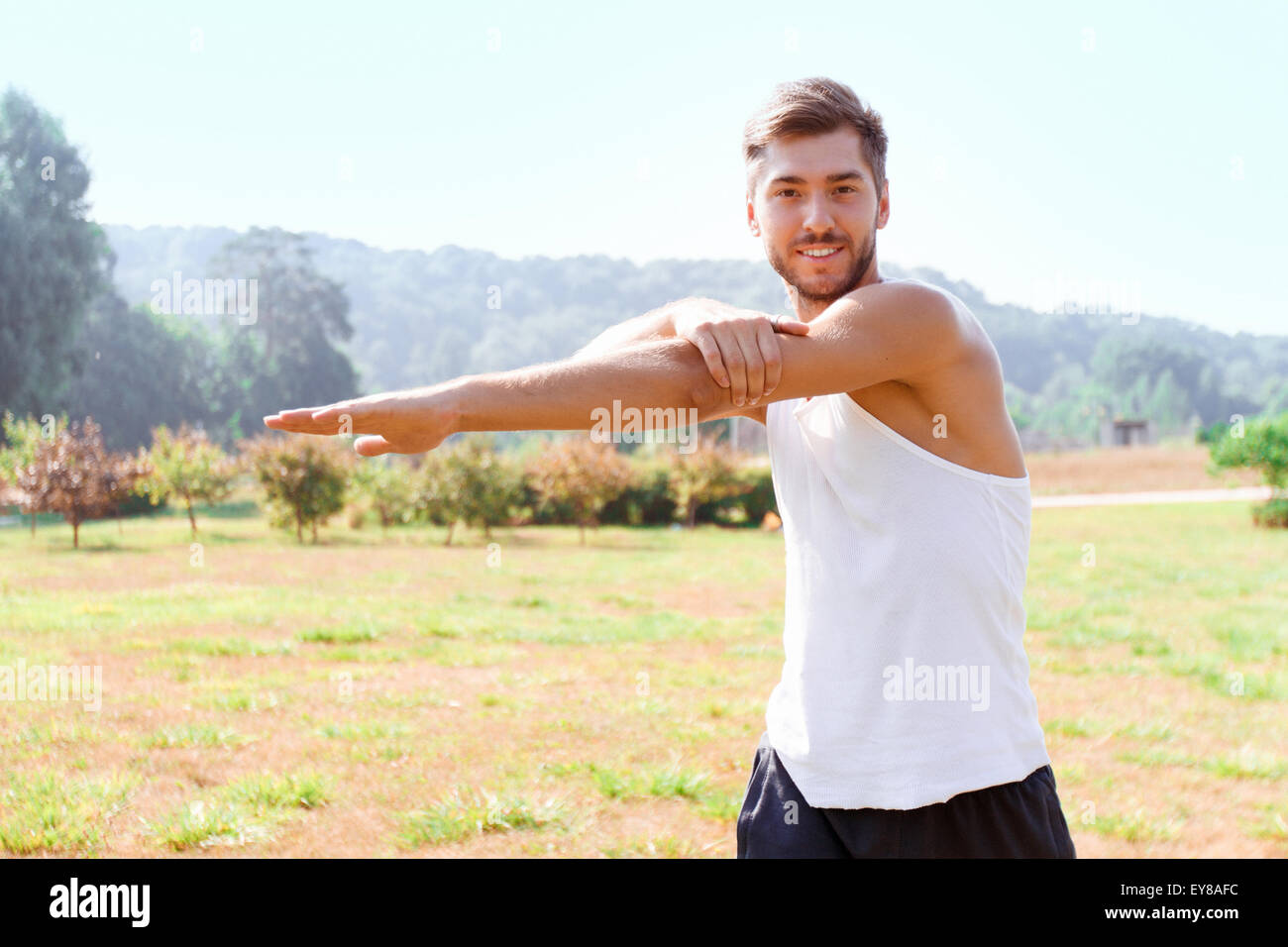 Nice guy doing hand exercises Stock Photo - Alamy