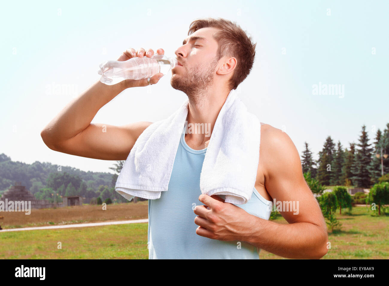 Handsome guy drinking water Stock Photo - Alamy