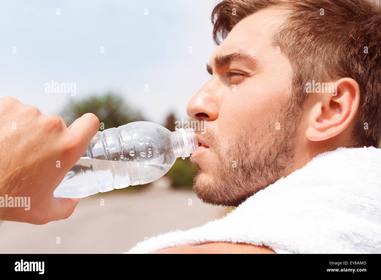 Handsome guy drinking water Stock Photo - Alamy