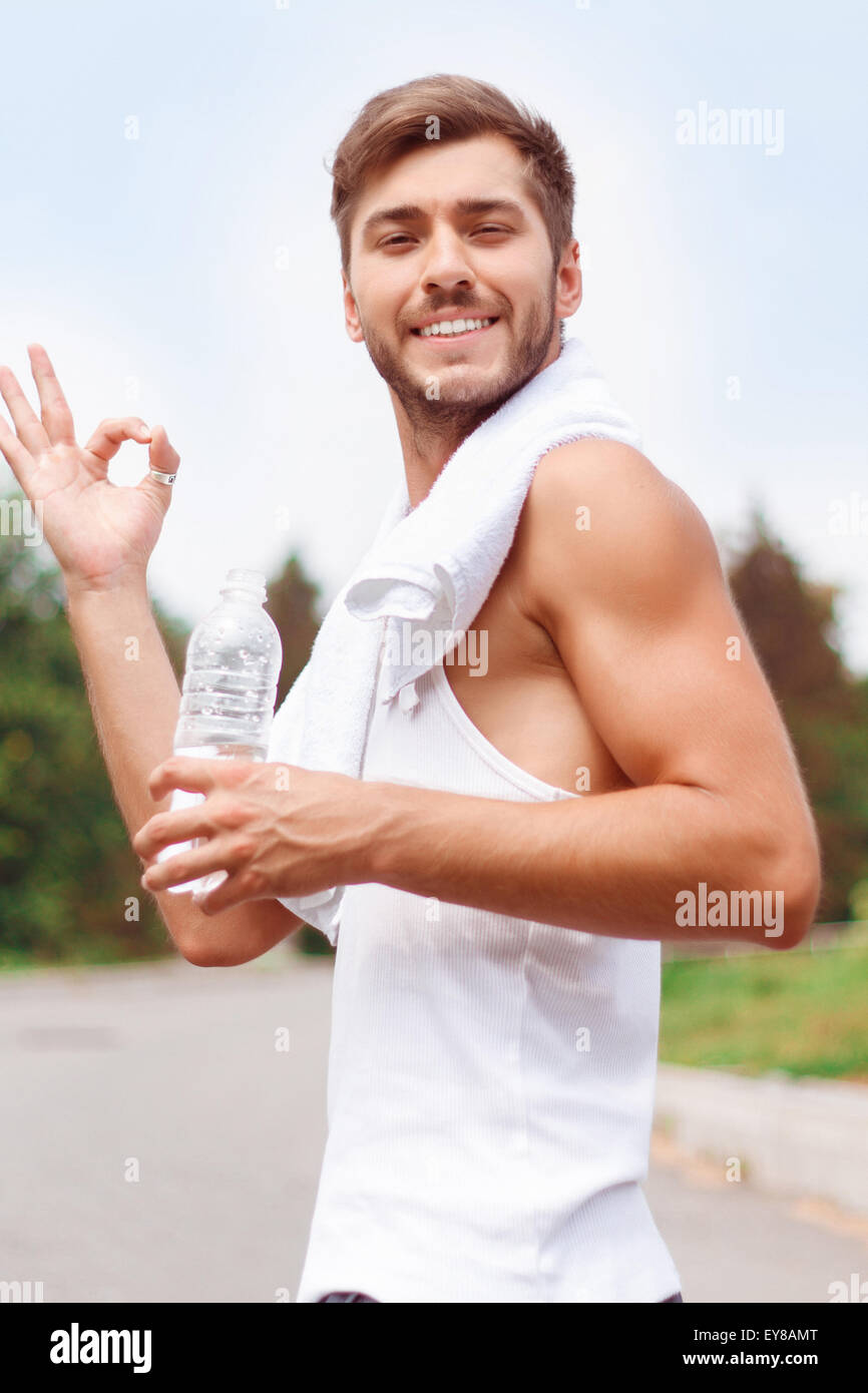 Handsome guy drinking water Stock Photo - Alamy